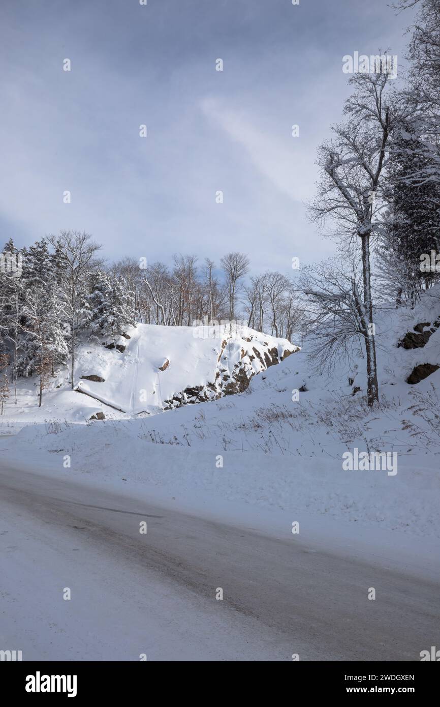 Snow on Road through Rocky landscape with trees in Muskoka Ontario in ...