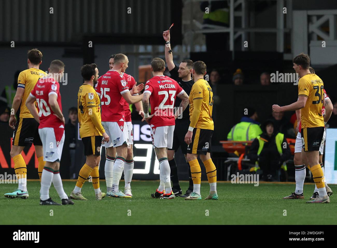 Newport, UK. 20th Jan, 2024. Referee Simon Mather shows a red card and ...