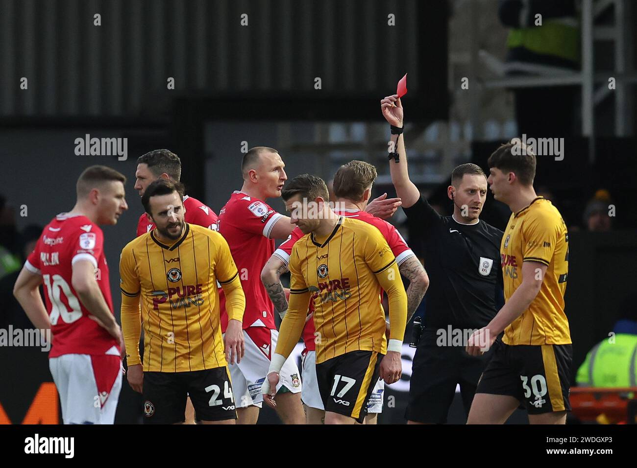 Newport, UK. 20th Jan, 2024. Referee Simon Mather shows a red card and ...