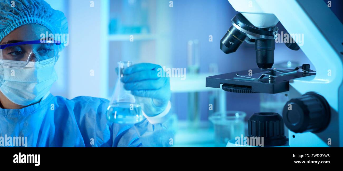 Testing, analysis and experiment. Laboratory employee and microscope ...