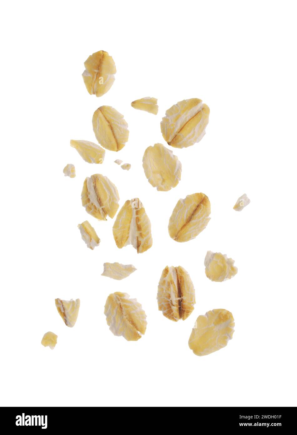Dry oat flakes falling on white background Stock Photo - Alamy