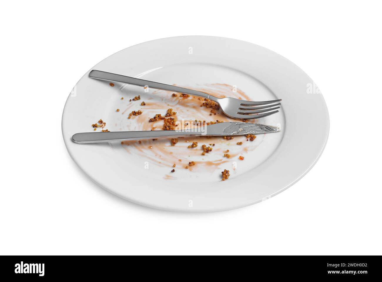 Dirty plate and cutlery on white background Stock Photo - Alamy