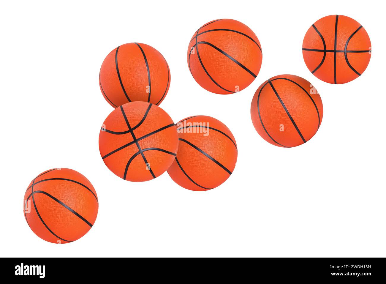 Many basketball balls flying on white background Stock Photo - Alamy