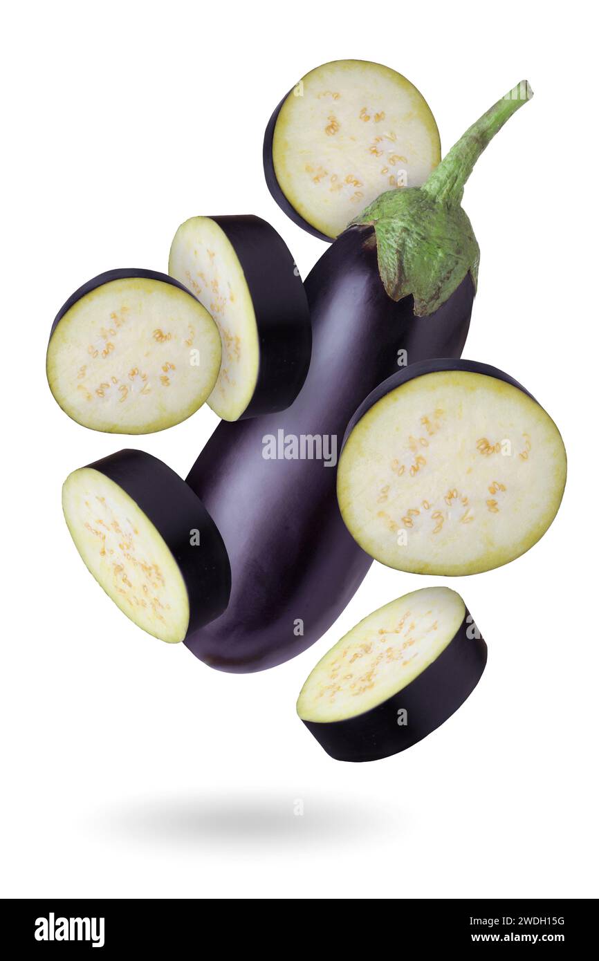 Fresh eggplants falling on white background, whole and slices Stock ...