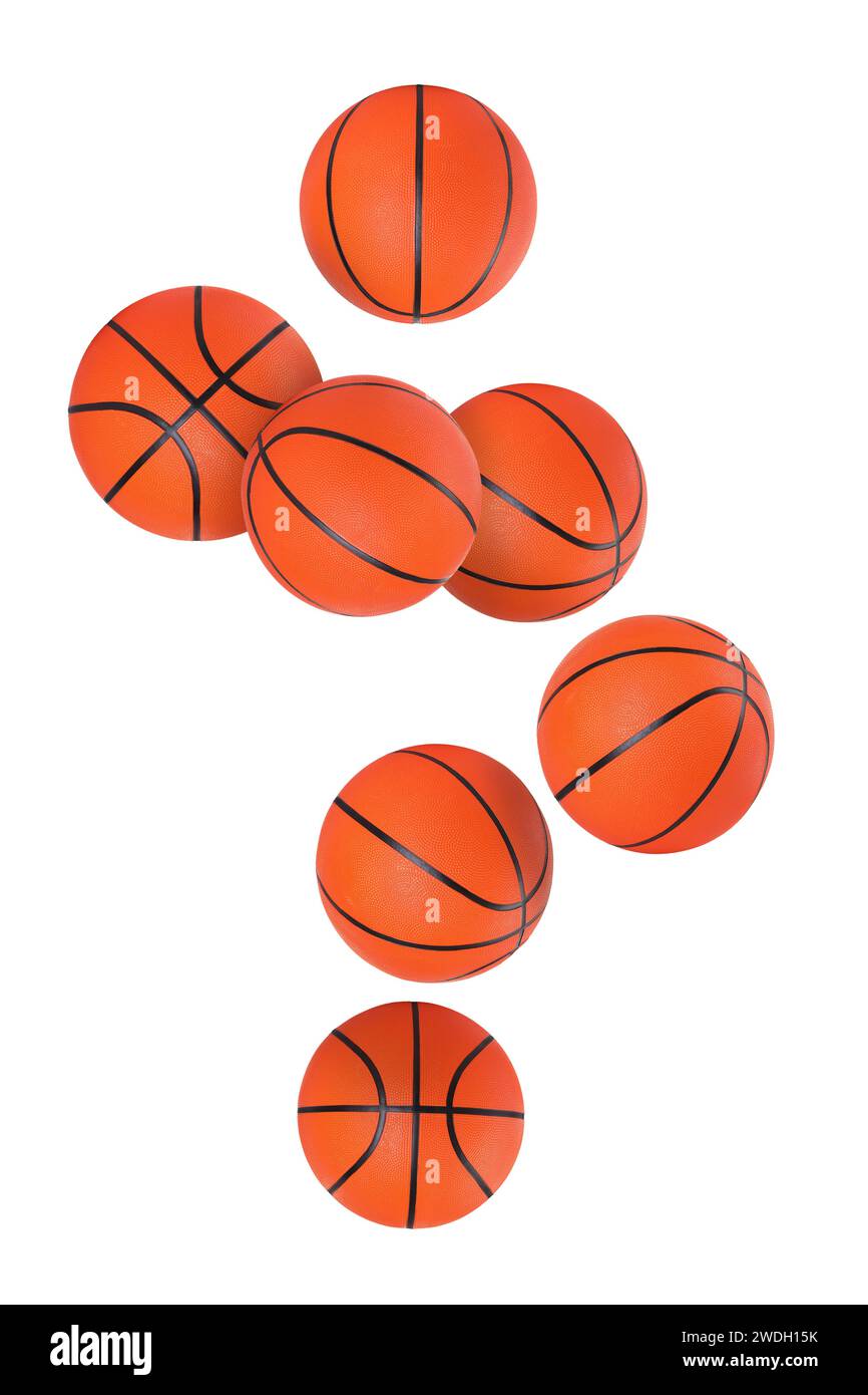 Many basketball balls flying on white background Stock Photo - Alamy