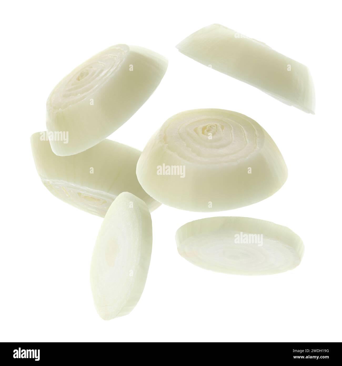 Fresh onion slices falling on white background Stock Photo - Alamy