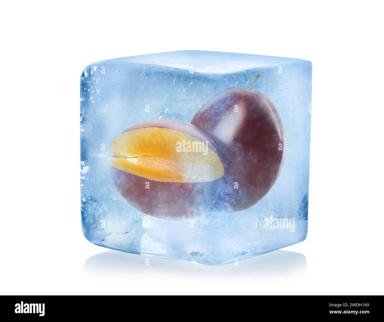 Frozen food. Raw plums in ice cube isolated on white Stock Photo - Alamy