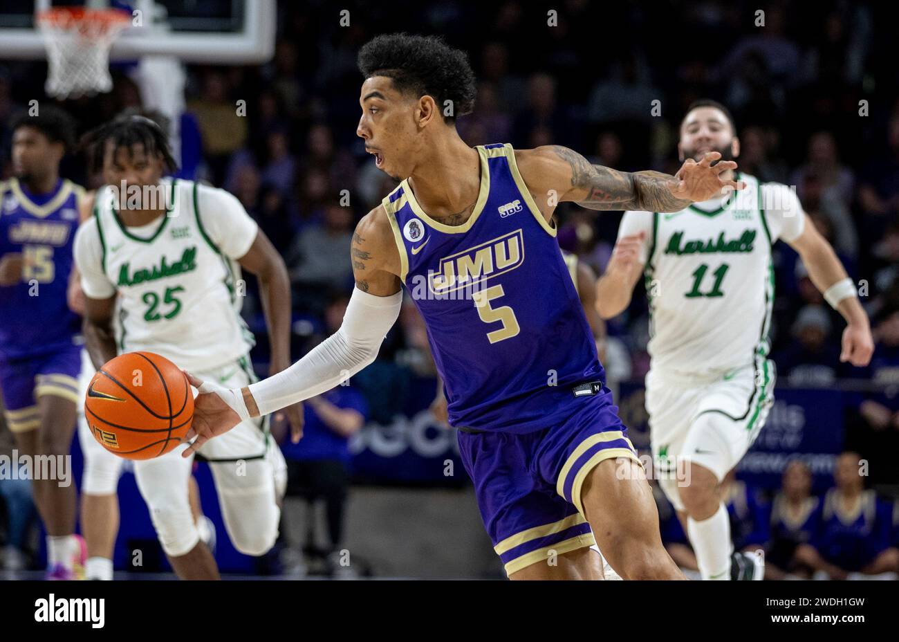 James Madison guard Terrence Edwards Jr. (5) takes off on a fast break ...