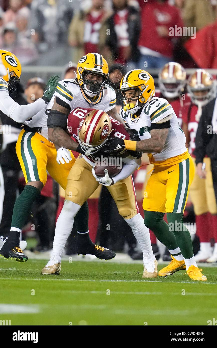 San Francisco 49ers wide receiver Deebo Samuel, middle, is tackled by ...