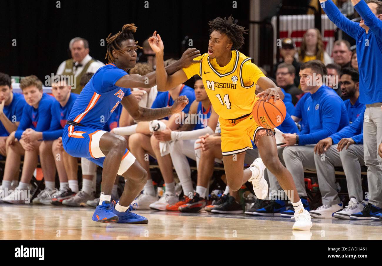Missouri's Anthony Robinson II, right, tries to drive past Florida's ...