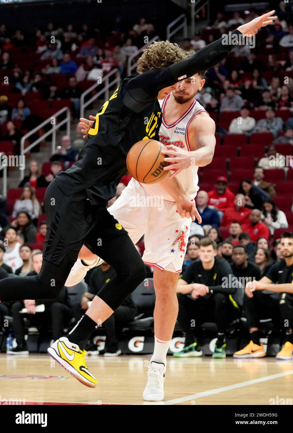 Houston Rockets center Alperen Sengun, right, throws the ball against Utah Jazz forward Lauri ...