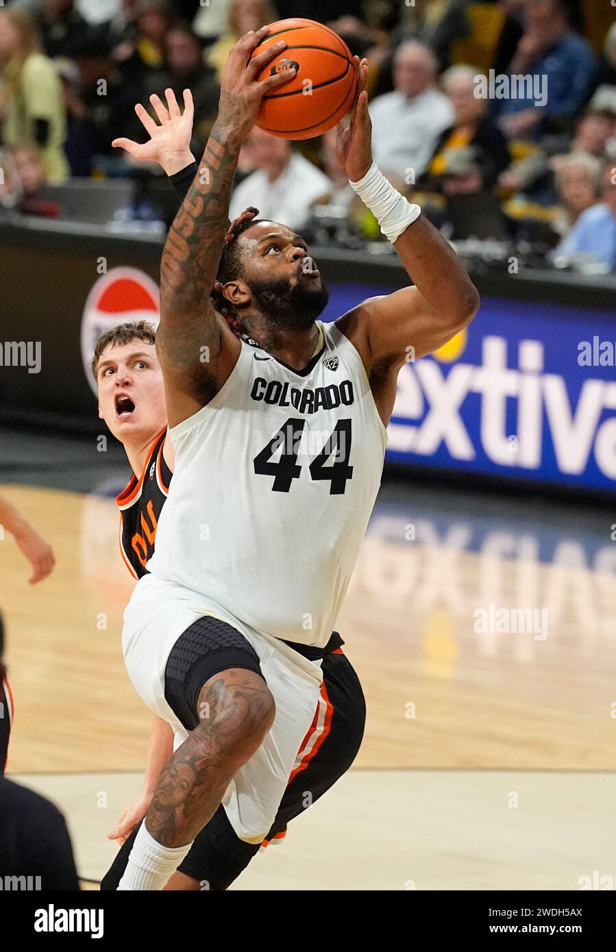 Colorado center Eddie Lampkin Jr. drives past Oregon State forward ...