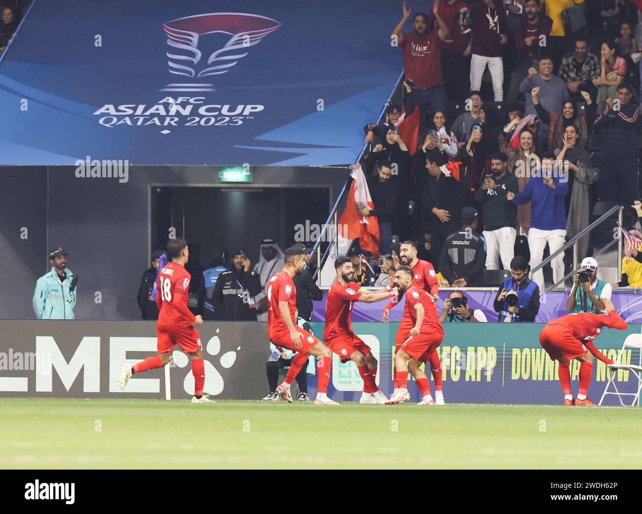 Doha, Qatar. 20th Jan, 2024. Players of Bahrain celebrate scoring ...