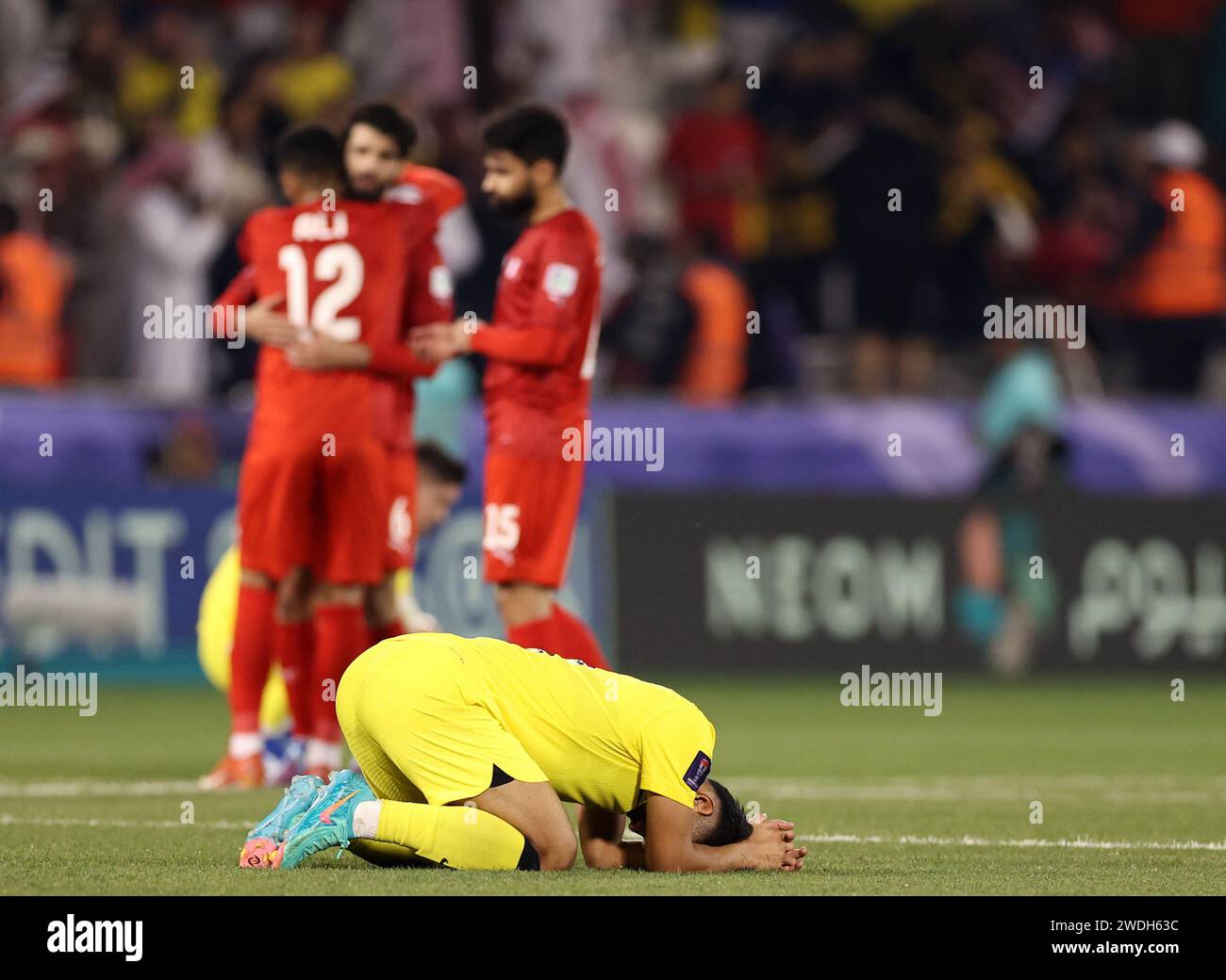 Doha, Qatar. 20th Jan, 2024. Shahrul Saad (front) of Malaysia reacts ...