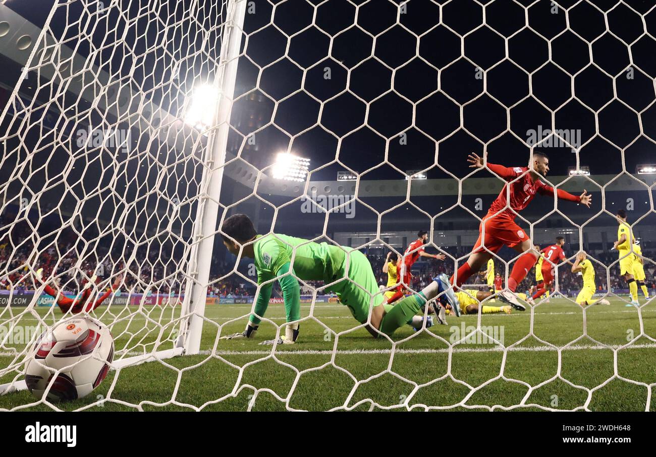 Doha, Qatar. 20th Jan, 2024. Ahmad Syihan Hazmi (front), goalkeeper of ...