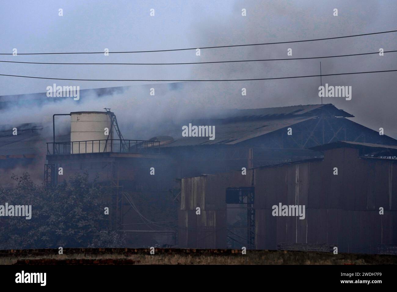Smoke erupts from a small iron factory in Lahore, Pakistan, Monday, Jan ...