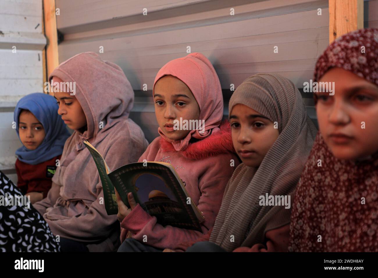 Gaza. 20th Jan, 2024. Palestinian girls study at a classroom in the ...