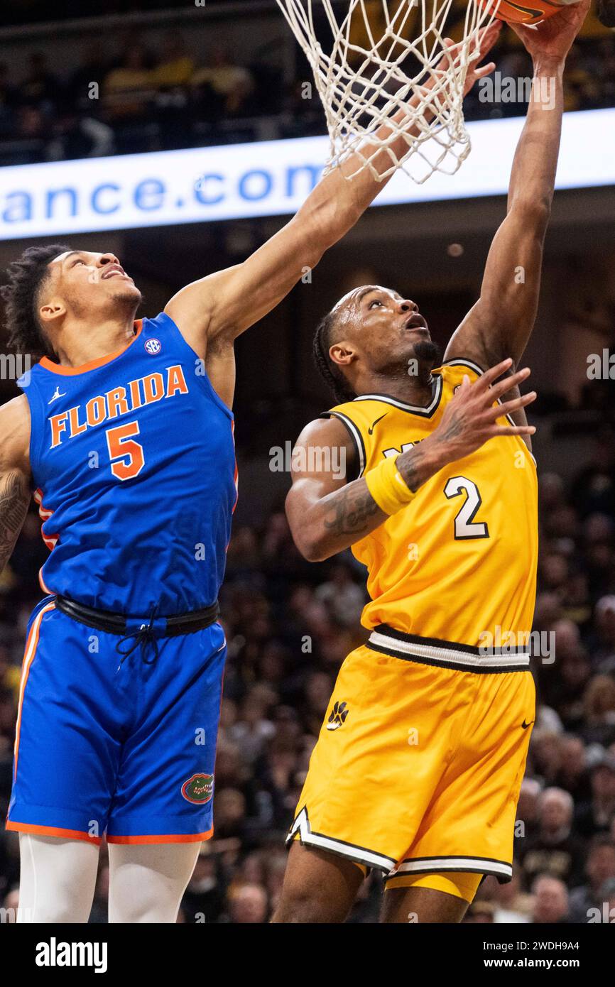 Missouri's Tamar Bates, right, shoots past Florida's Will Richard ...