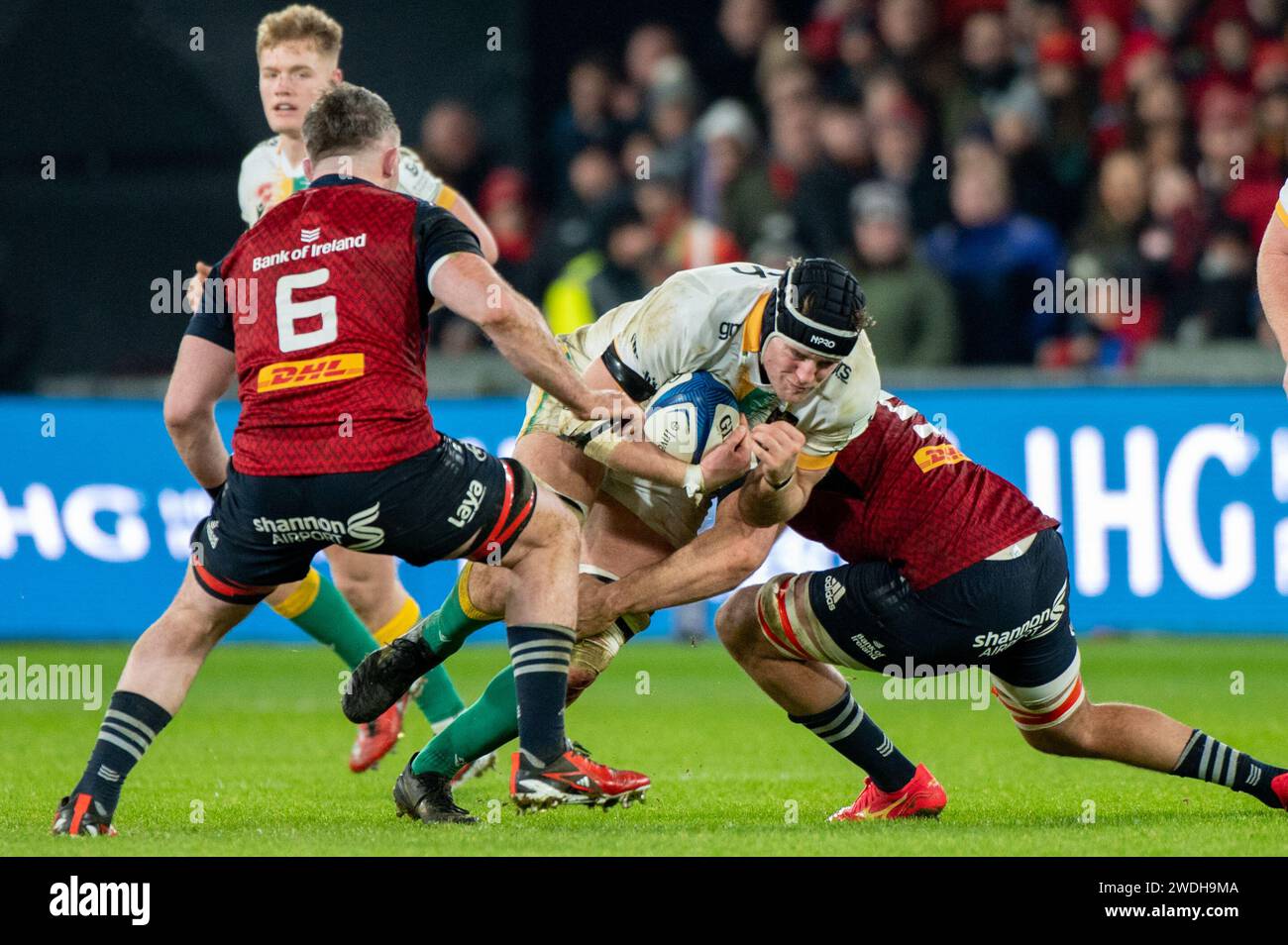 Limerick, Ireland. 21st Jan, 2024. Alex Coles of Northampton tackled by ...