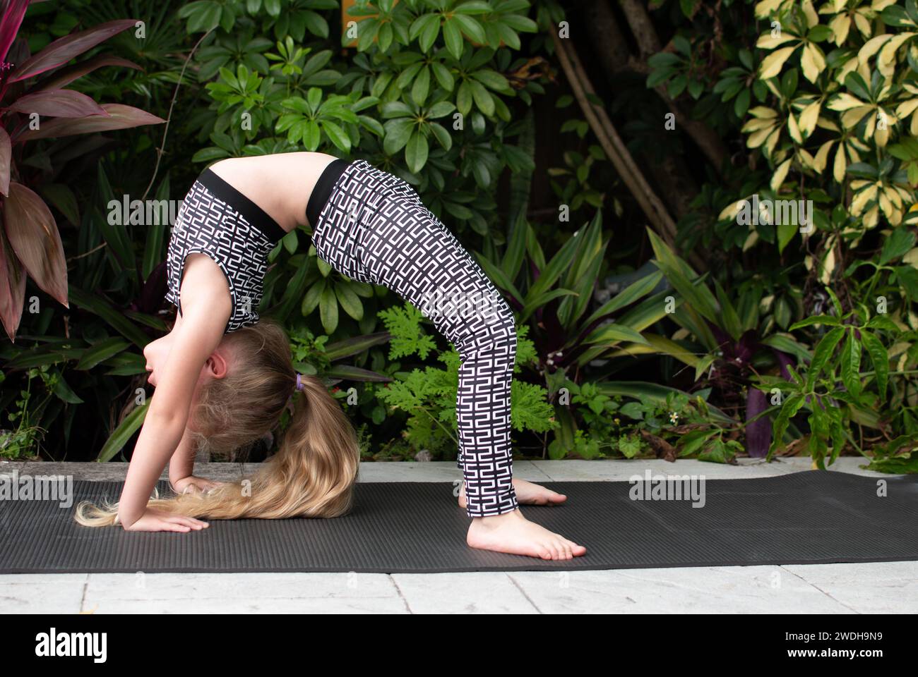 Little girl doing gymnastics outdoors. 6 year old gymnastics. Sport and ...