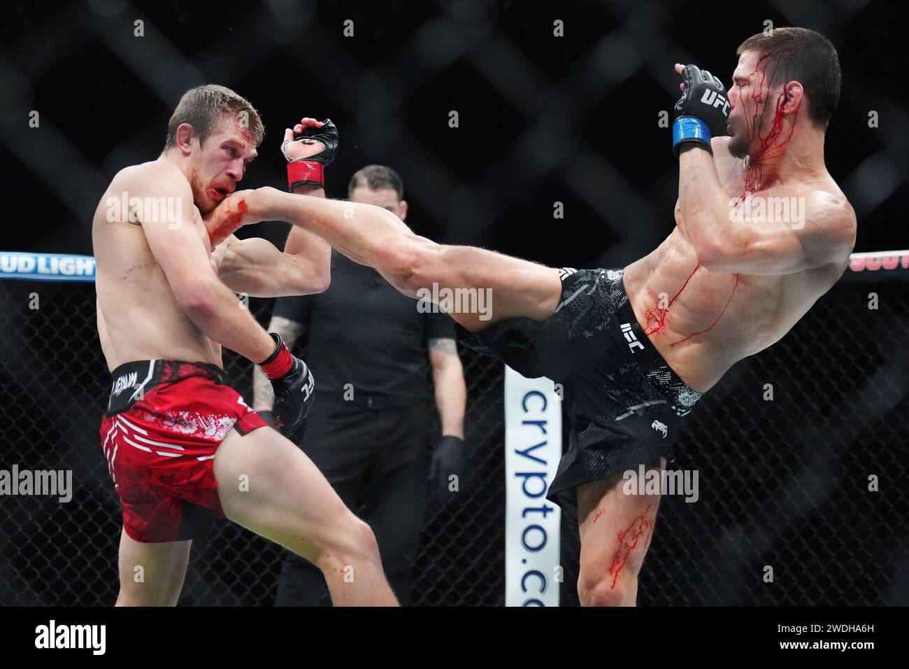 Arnold Allen, left, is kicked by Movsar Evloev during a featherweight ...