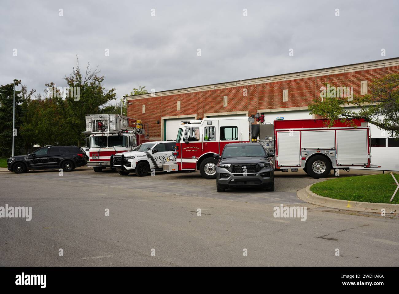 Police and Fire Department with police cars and fire trucks parked ...