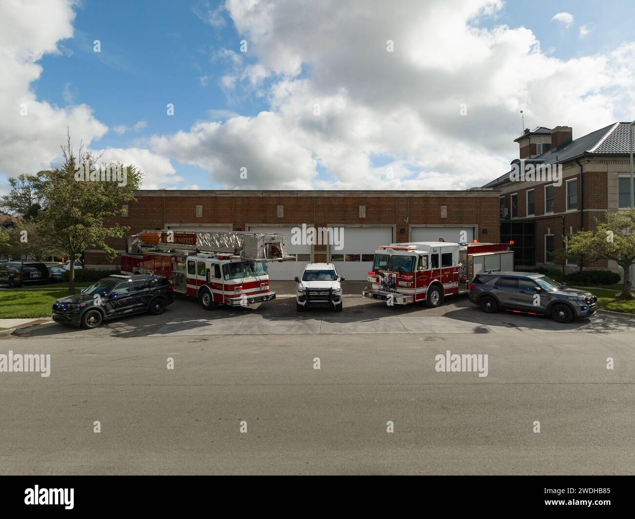 Police and Fire Department with police cars and fire trucks parked ...