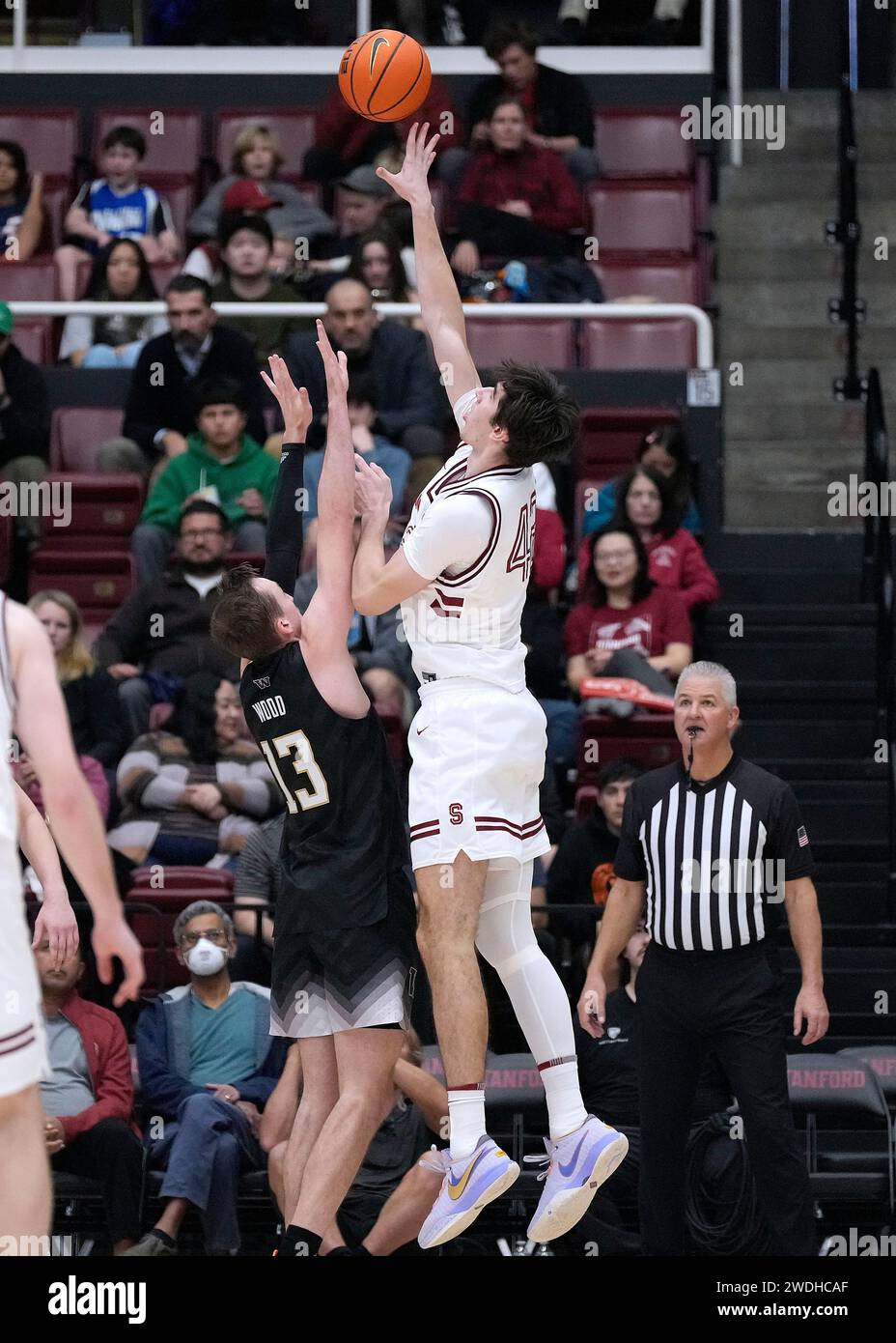 Stanford forward Maxime Raynaud, center right, shoots over Washington ...