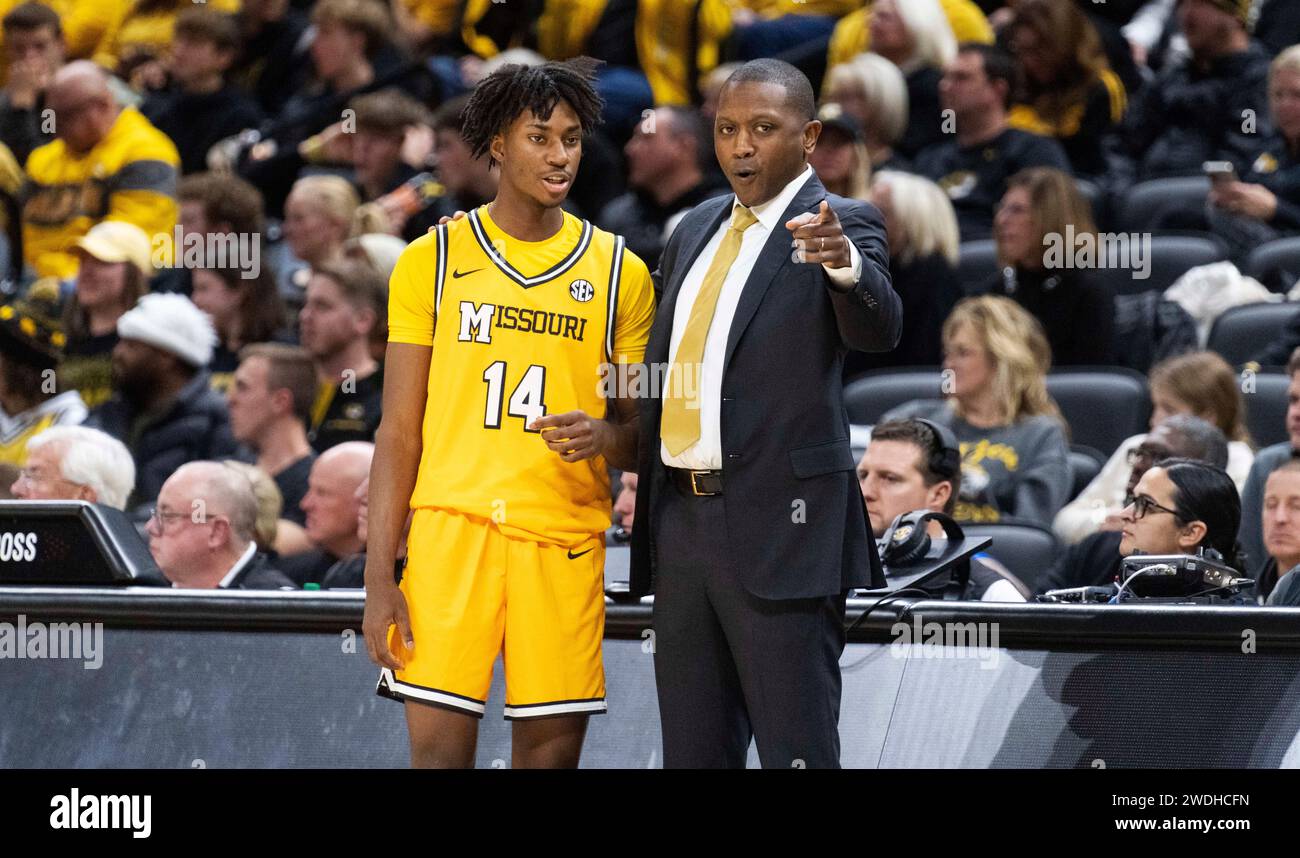Missouri head coach Dennis Gates, right, talks with Anthony Robinson II ...