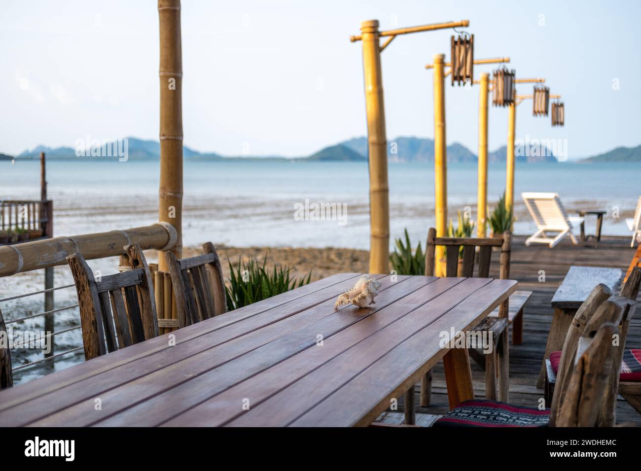 Outdoor seating and bar counter on the terrace, with view of the sea on ...