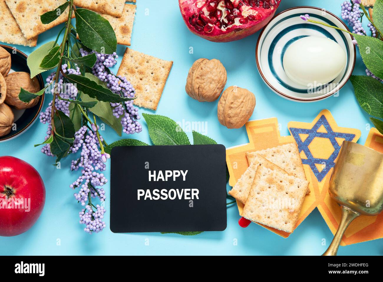 Passover celebration concept. Matzah, red kosher walnut and spring ...