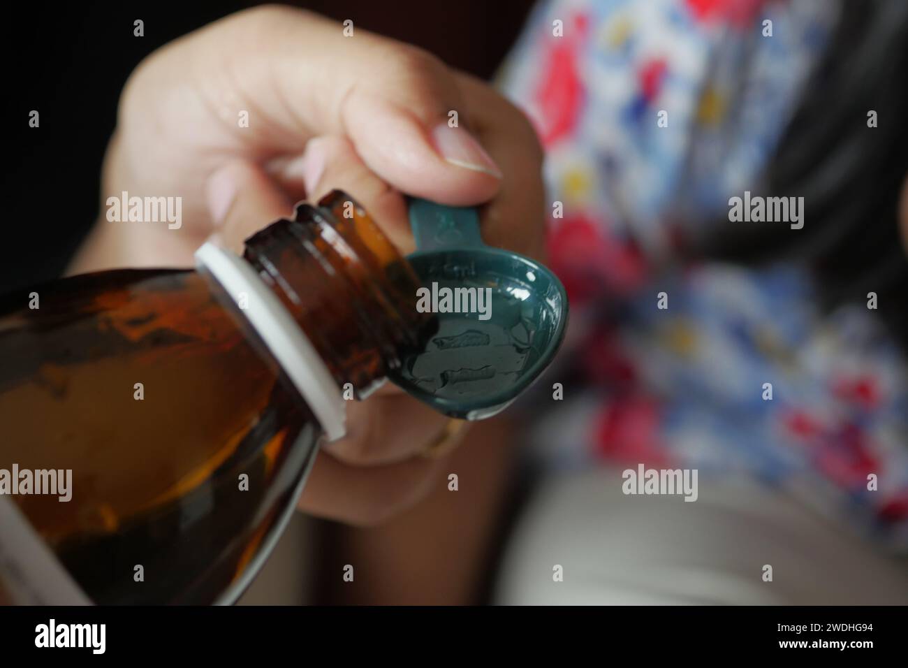 A dose of cough syrup Stock Photo - Alamy