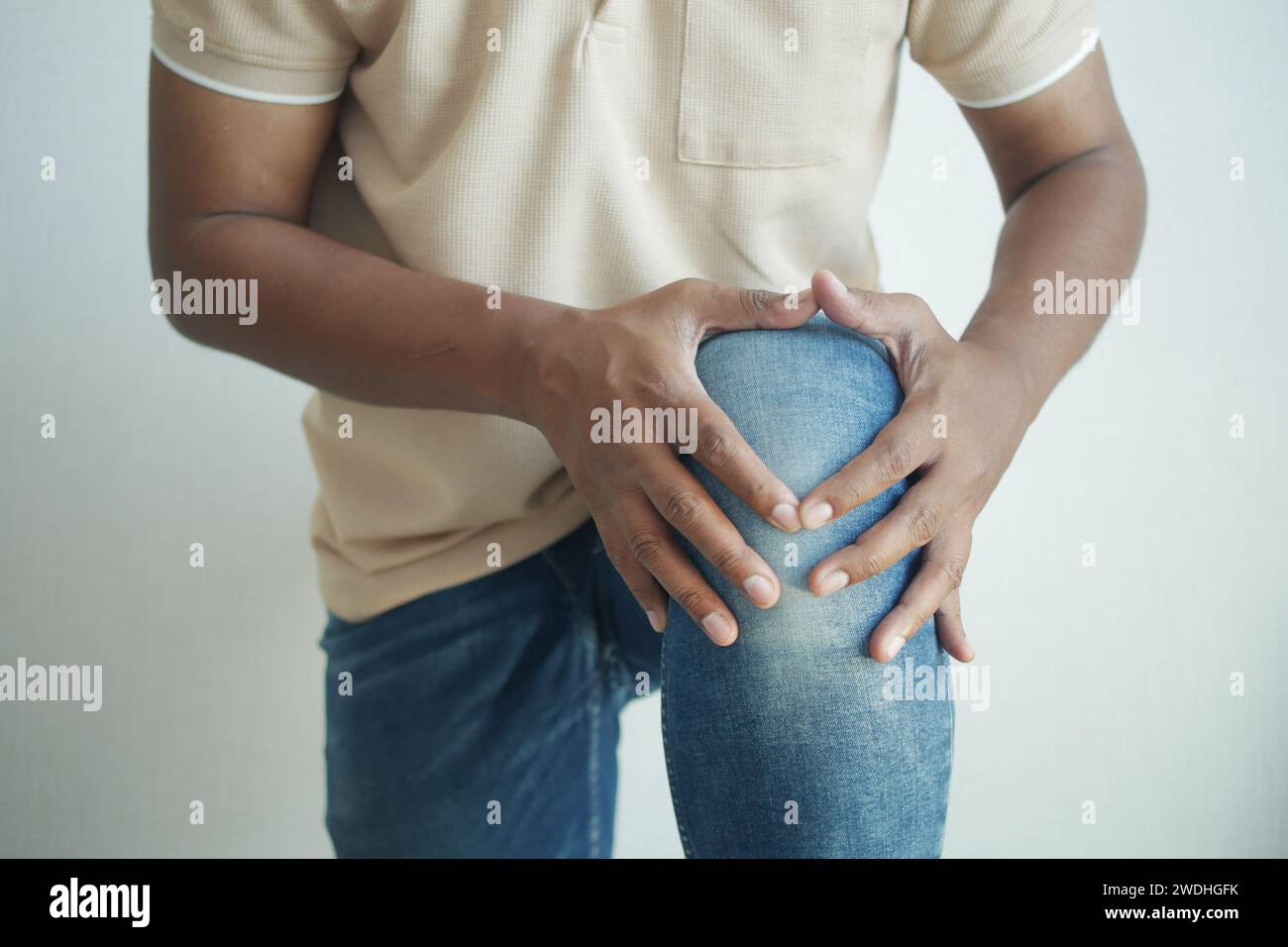 Close up on man suffering knee joint pain Stock Photo - Alamy