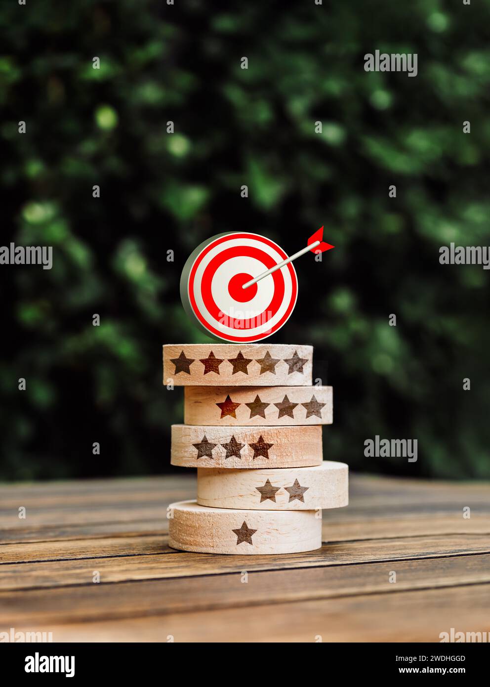 3d goal target icon on top of round wood block stack with one to five ...