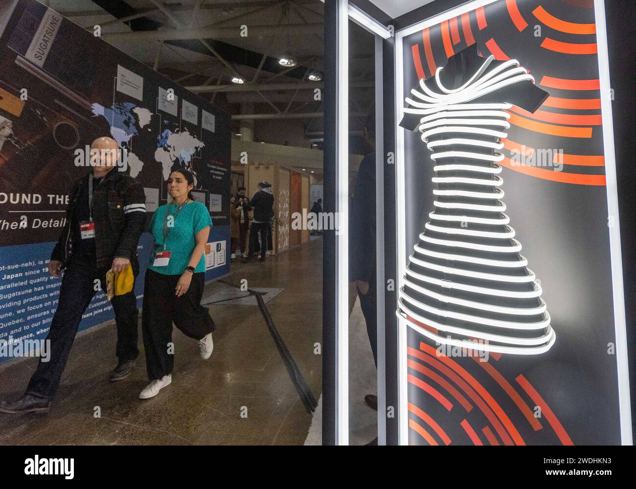 Toronto, Canada. 20th Jan, 2024. People walk past a light installation ...