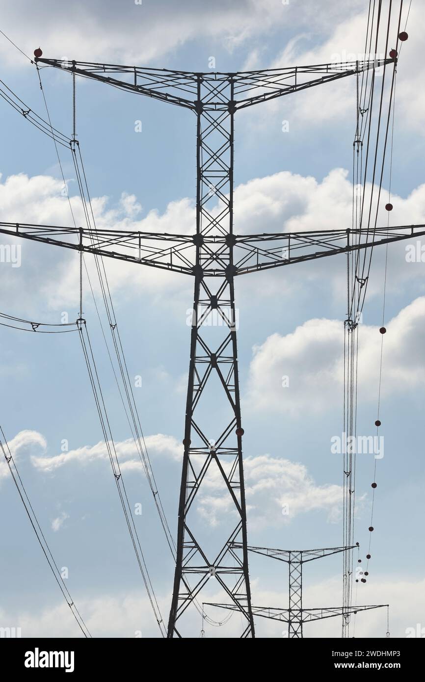 Electricity pylon under the clouds Stock Photo - Alamy