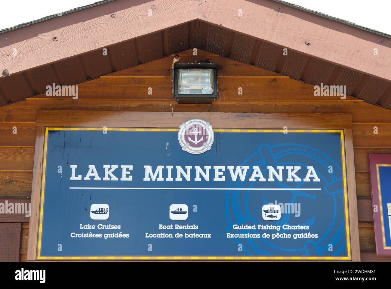 Lake minnewanka sign with swallow nest Stock Photo - Alamy