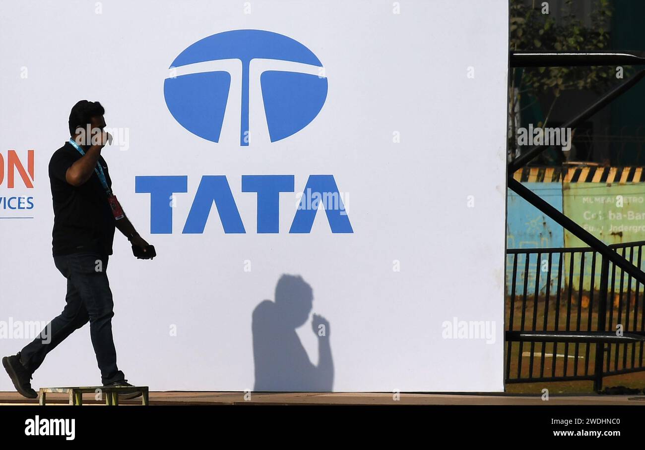 Mumbai, India. 20th Jan, 2024. A man walks past a Tata logo in Mumbai ...