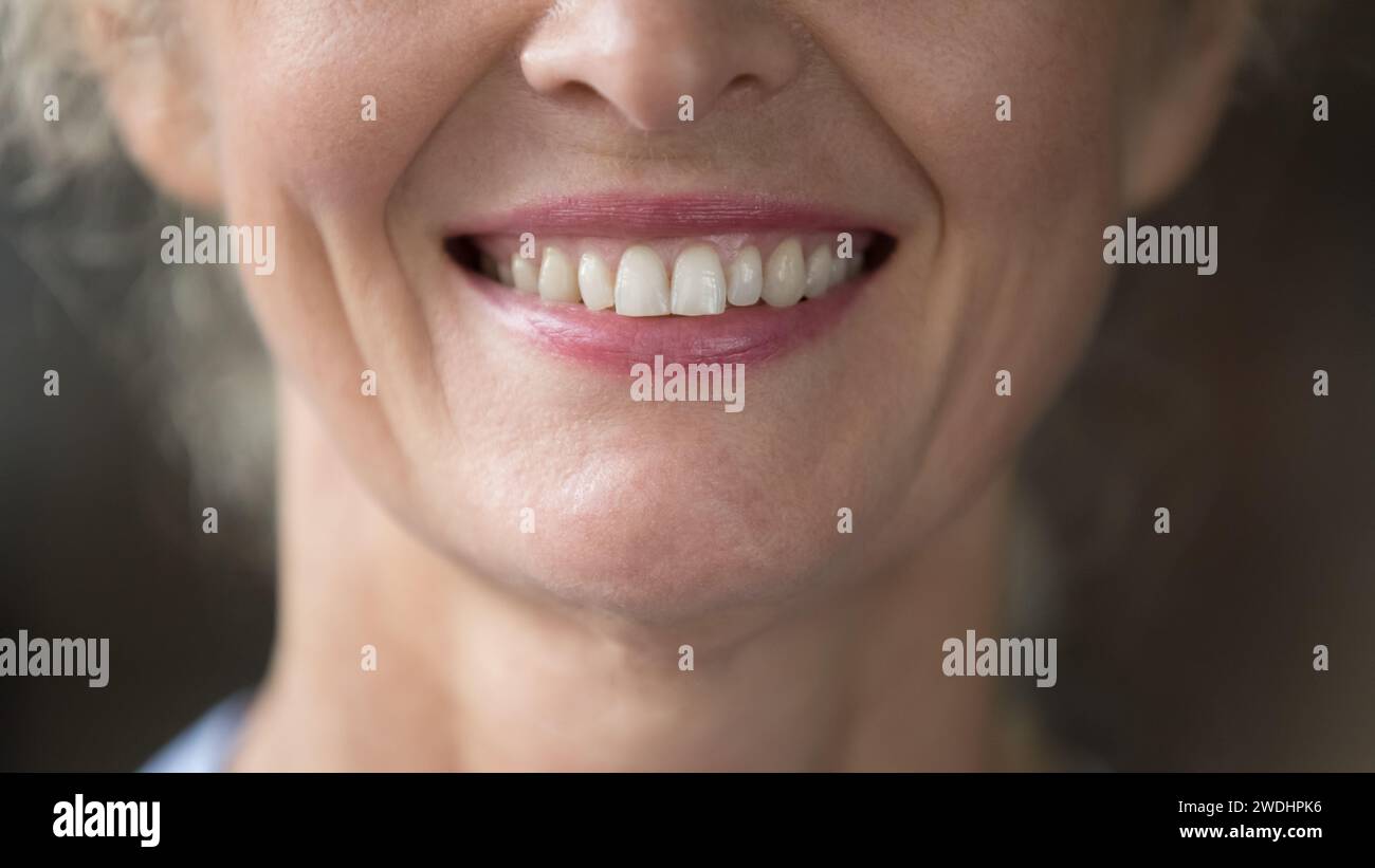 Close up shot lower face view of smiling older female Stock Photo - Alamy