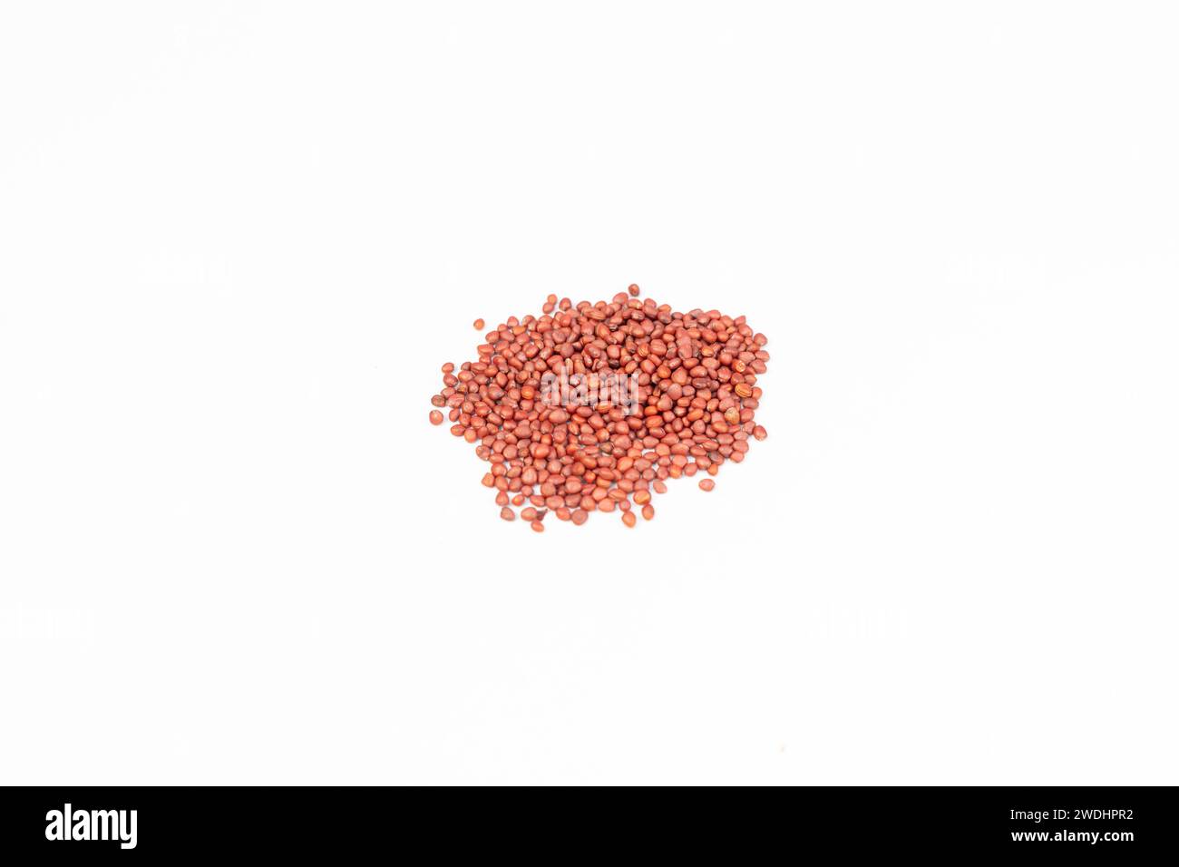Heap of a red radish seeds on white isolated background Stock Photo - Alamy