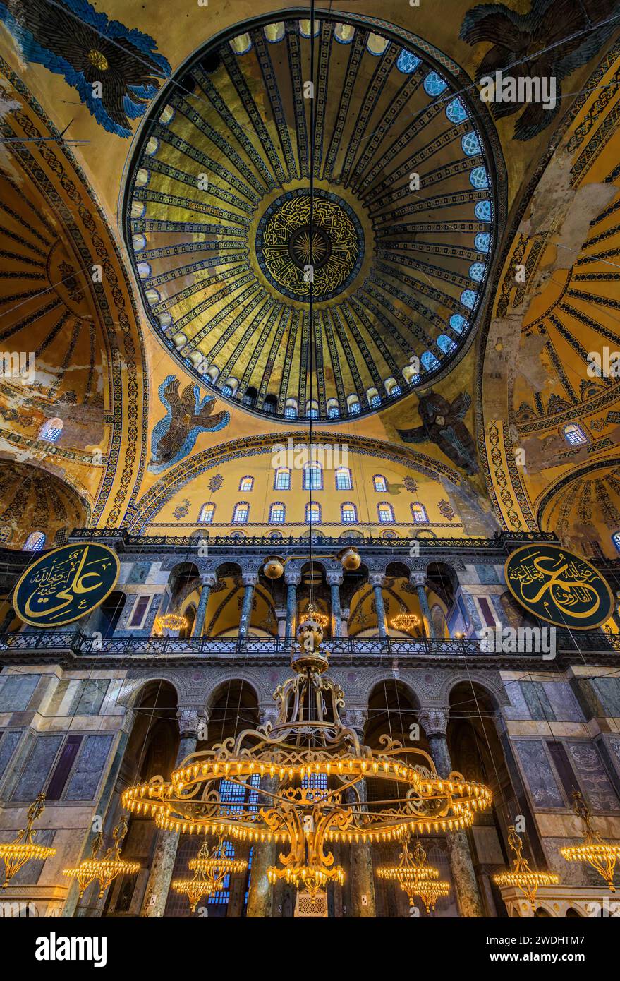 Istanbul, Turkey - November 8, 2023: Ornate dome with goldleaf mosaics and frescoes, Hagia ...