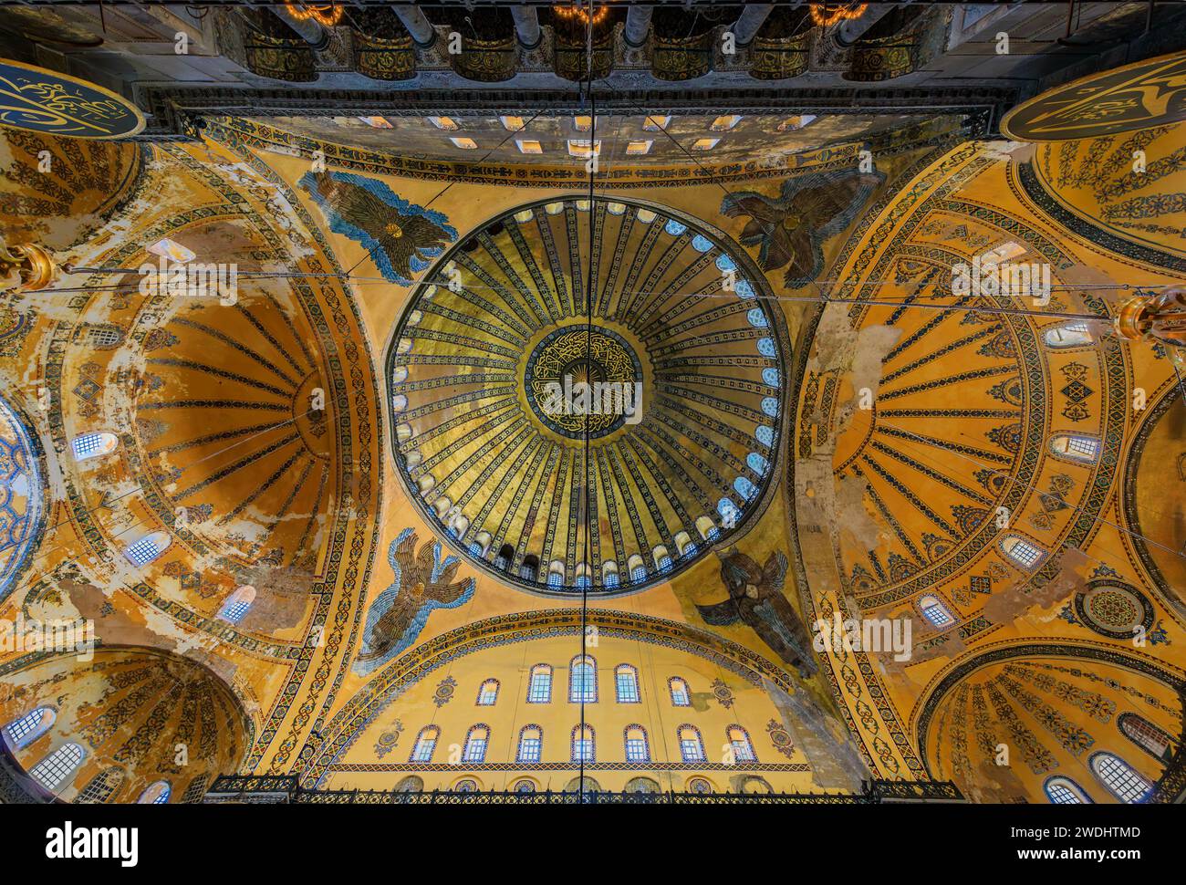 Istanbul, Turkey - November 8, 2023: Ornate dome with goldleaf mosaics and frescoes, Hagia ...