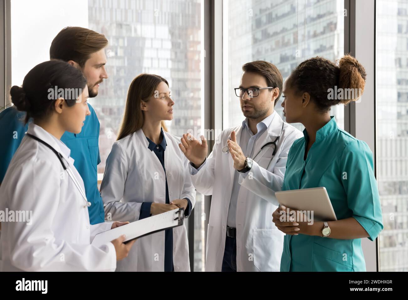 Diverse female doctors talking male hi-res stock photography and images ...
