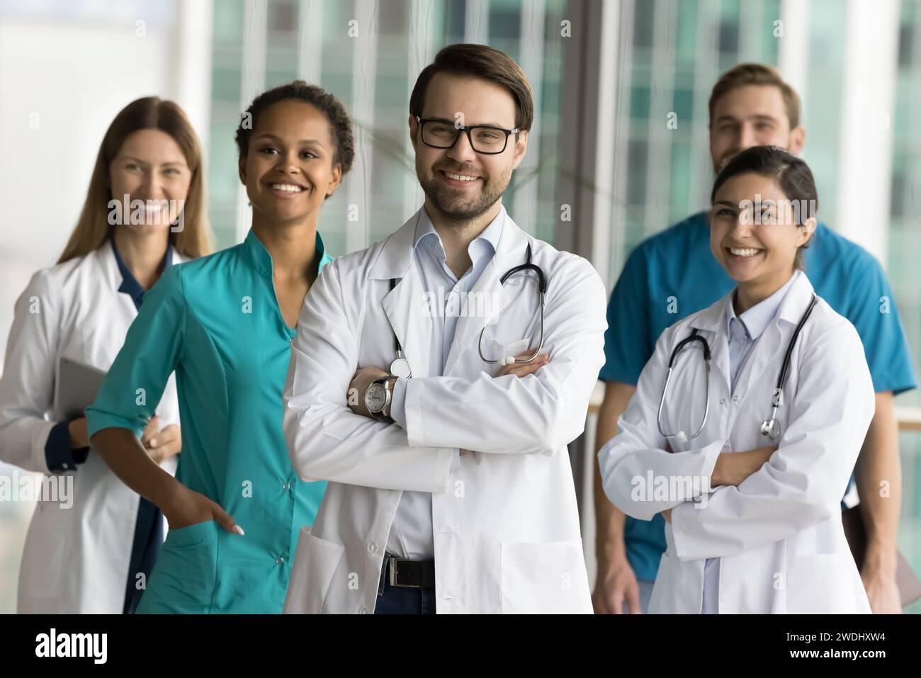 Happy chief doctor man with stethoscope posing for group port Stock ...