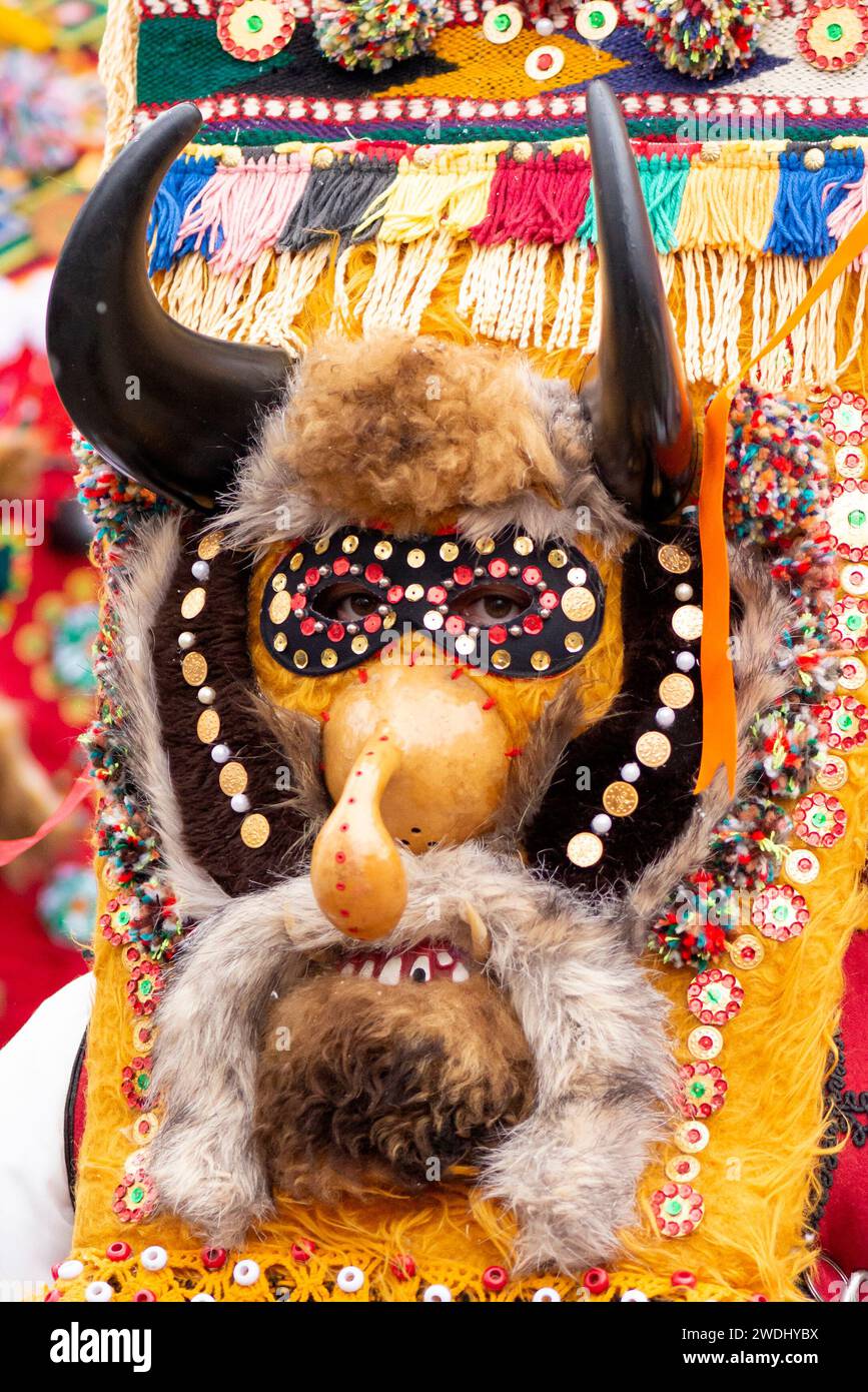 Kukeri dancer portrait with distinctive embroidered colourful mask at ...