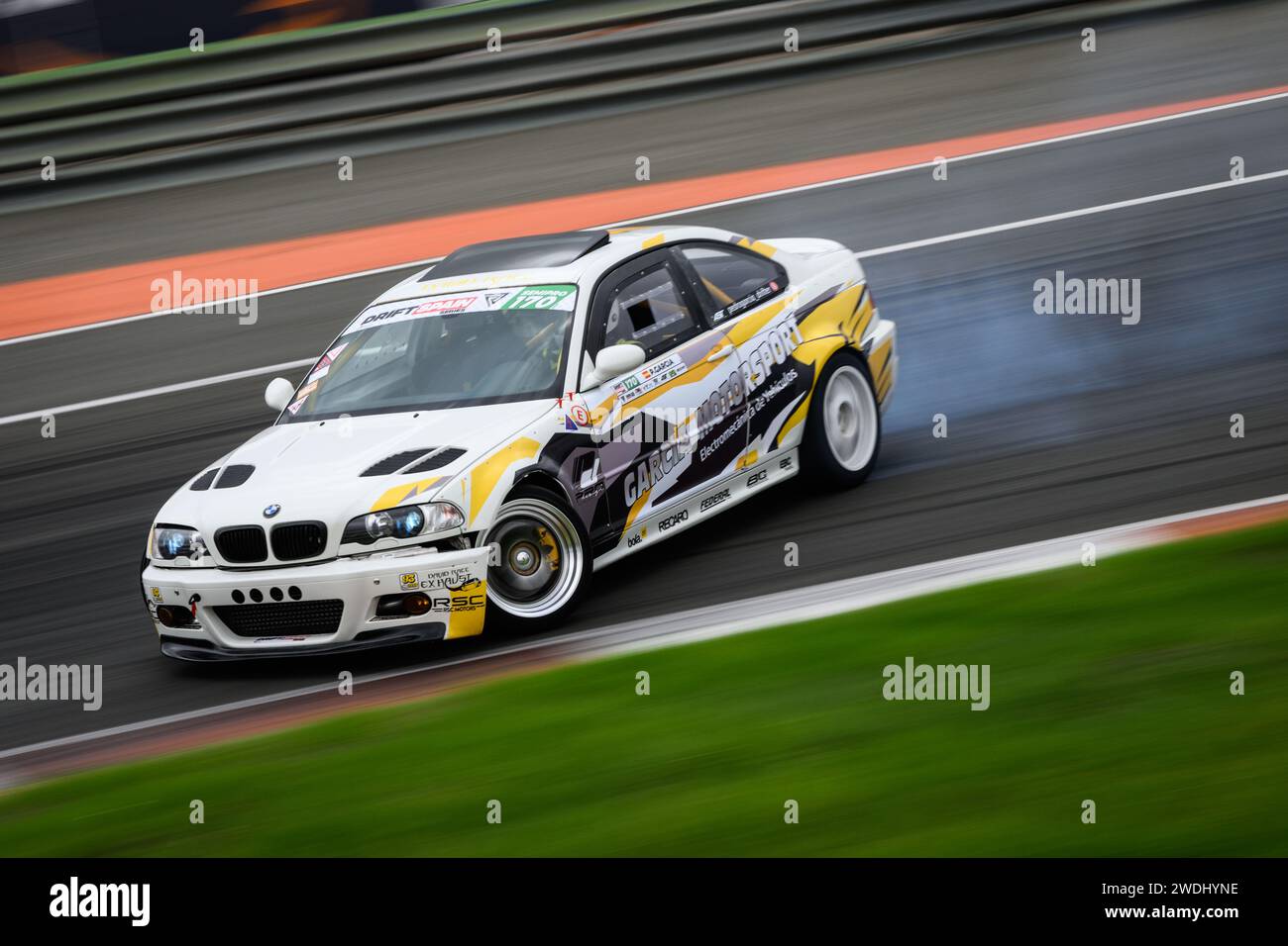 High speed car drifting with smoke around the Ricardo Tormo circuit in ...