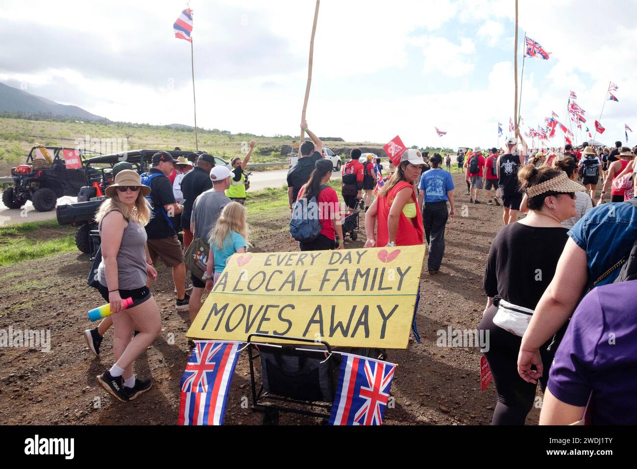 Lahiana, Hawaii, USA. 20th Jan, 2024. A Maui resident marches in the ...