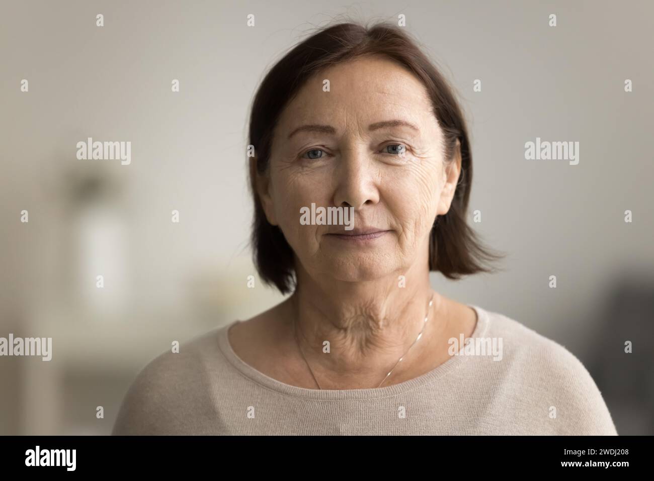 Indoor head shot portrait of serious positive old mature woman Stock ...