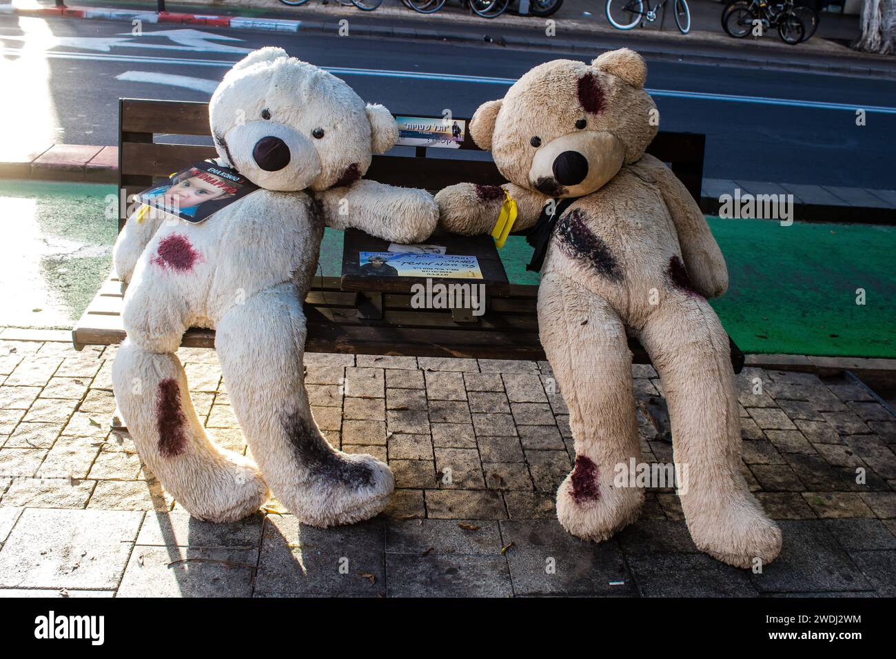 Tel Aviv, Israel - January 20, 2024 Bears sitting on a bench in memory ...
