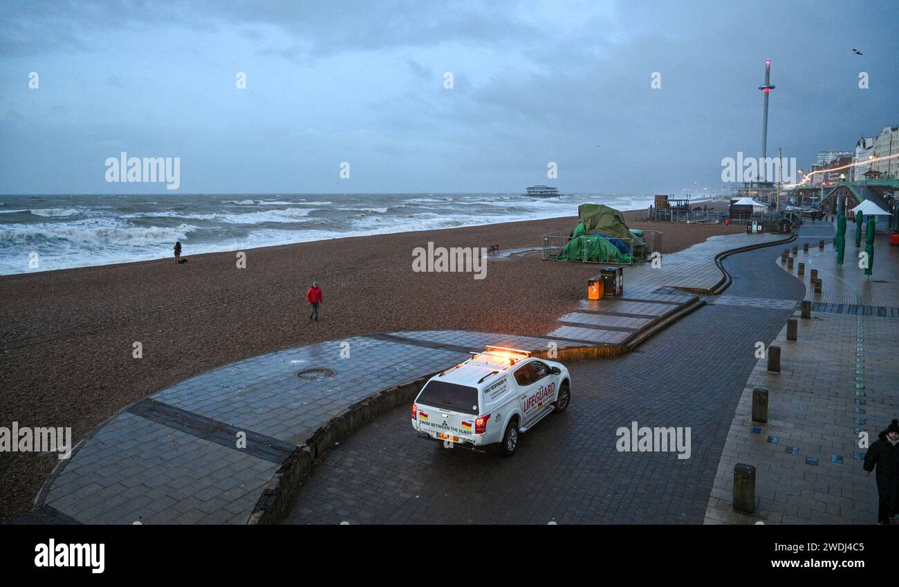Brighton UK 21st January 2024 - A Lifeguard patrol checks out Brighton ...